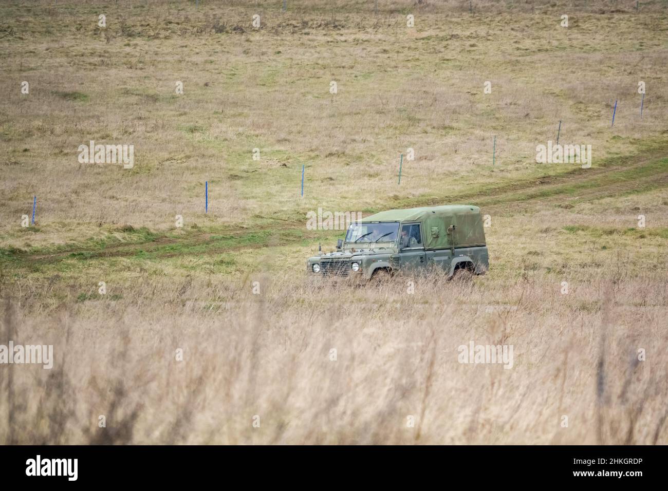 land rover defender wolf army medium utility vehicle on a military ...