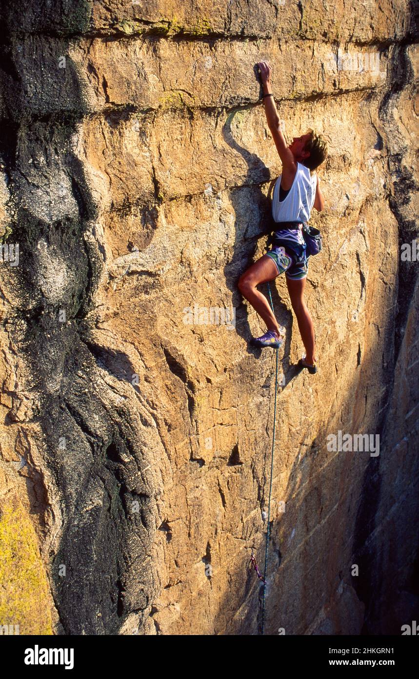 Female rock climber climbing a difficult route at Windy Point. Santa ...