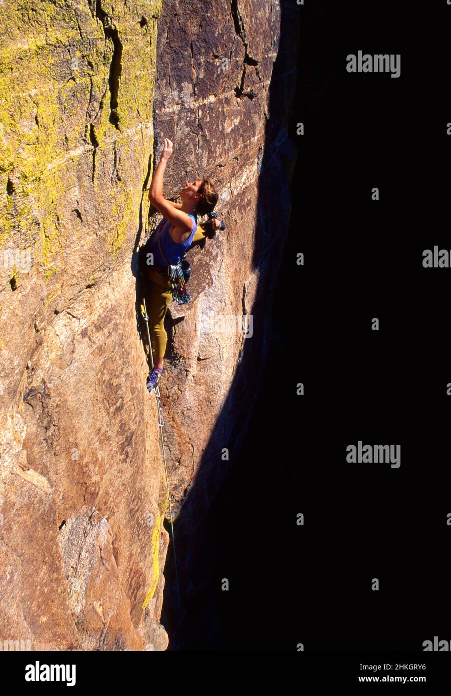 Female rock climber climbing a difficult route at Windy Point. Santa ...