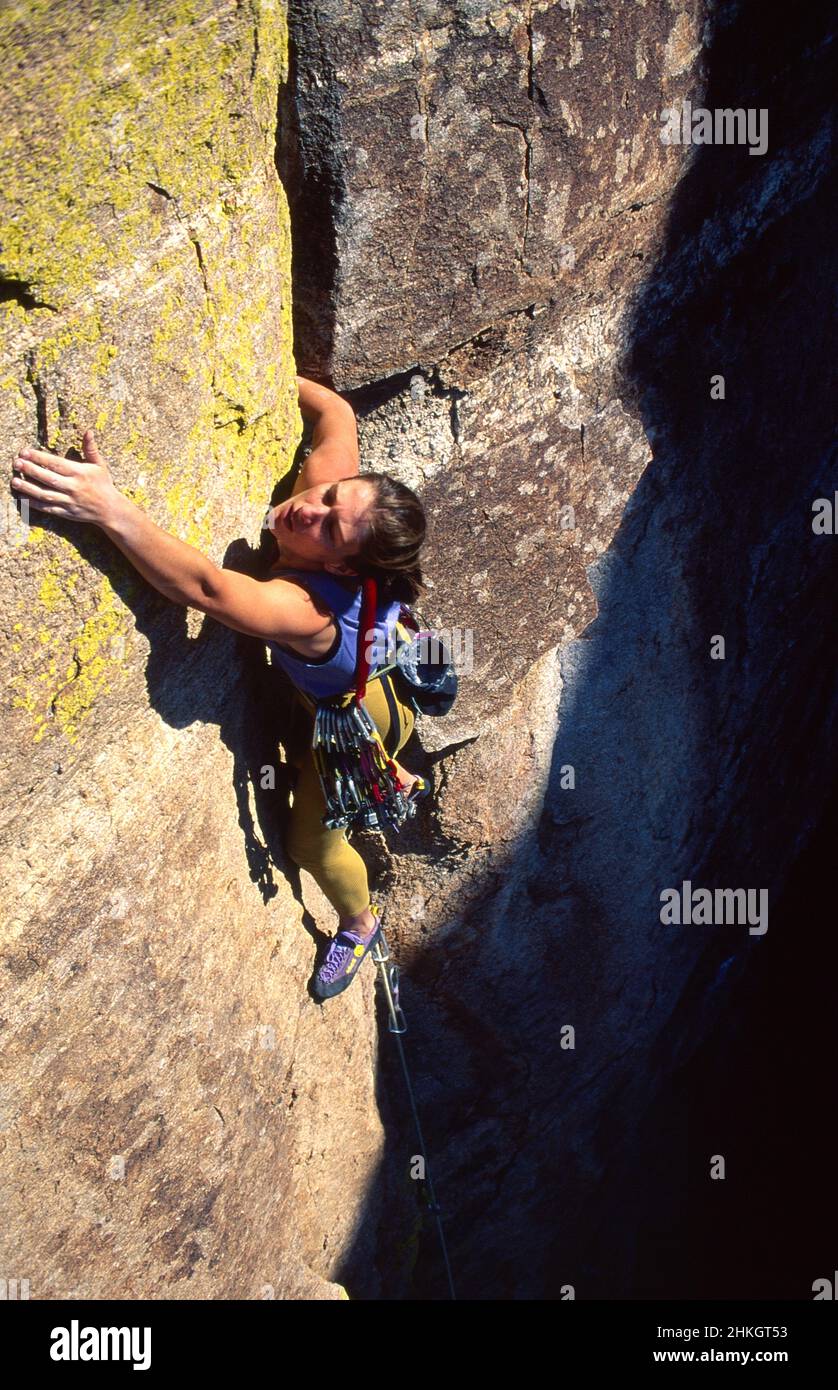 Female rock climber climbing a difficult route at Windy Point. Santa ...