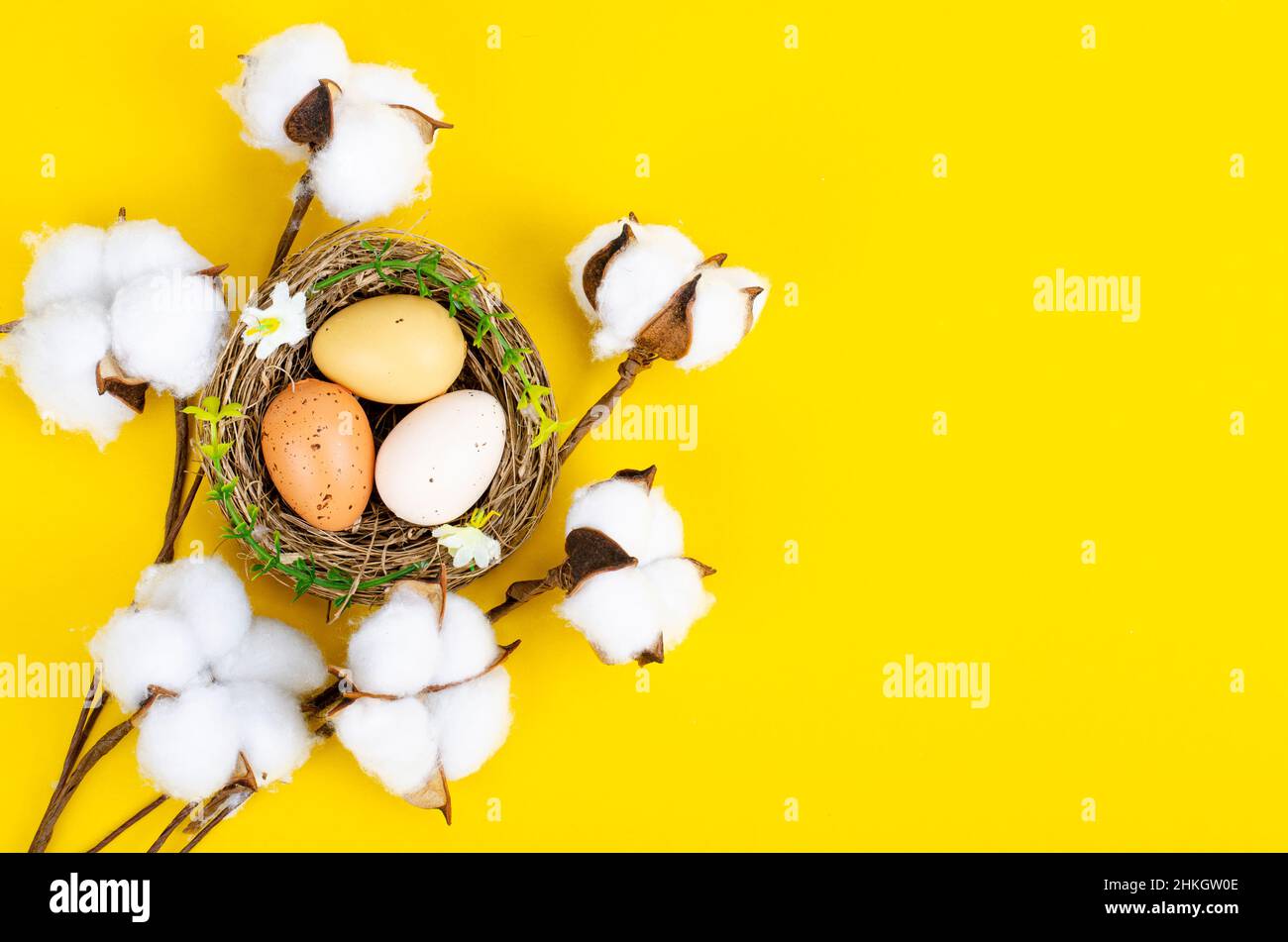 Top view of color easter haqndmade eggs and nest flatlay. Trendy ...