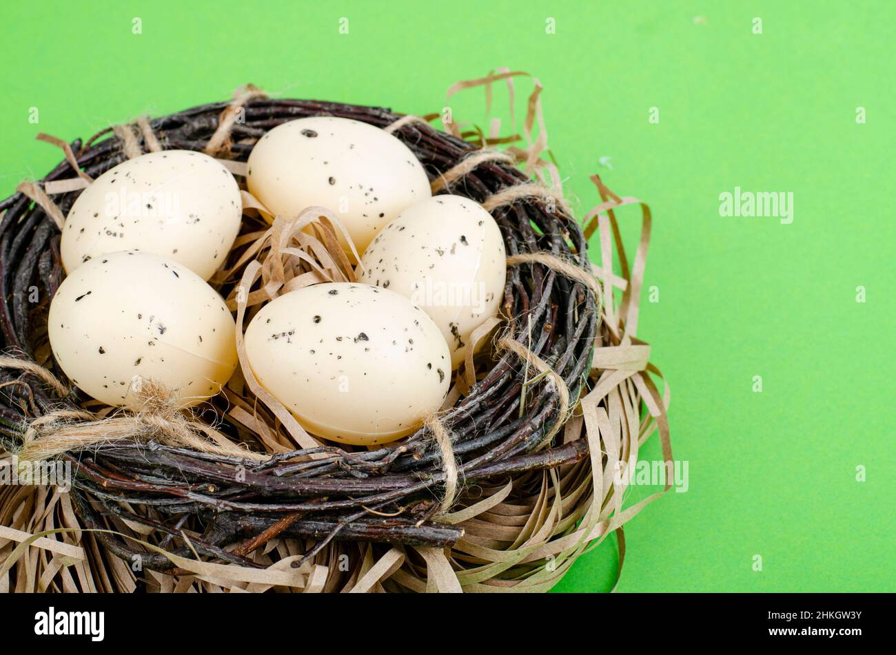 Top view of color easter haqndmade eggs and nest flatlay. Trendy ...