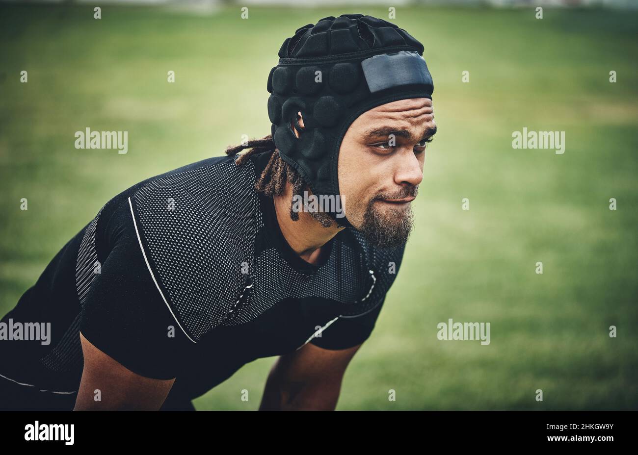 I need to catch a breath. Cropped shot of a handsome young rugby player ...
