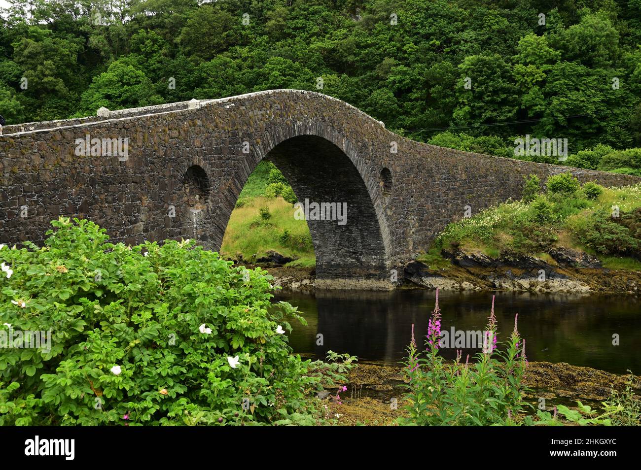 A view of the old stone bridge over the Atlantic. A narrow stretch of ...