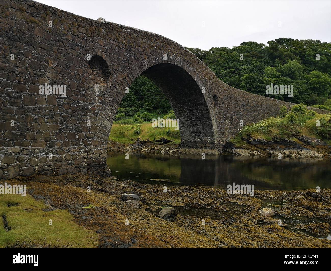 A view of the old stone bridge over the Atlantic. A narrow stretch of ...