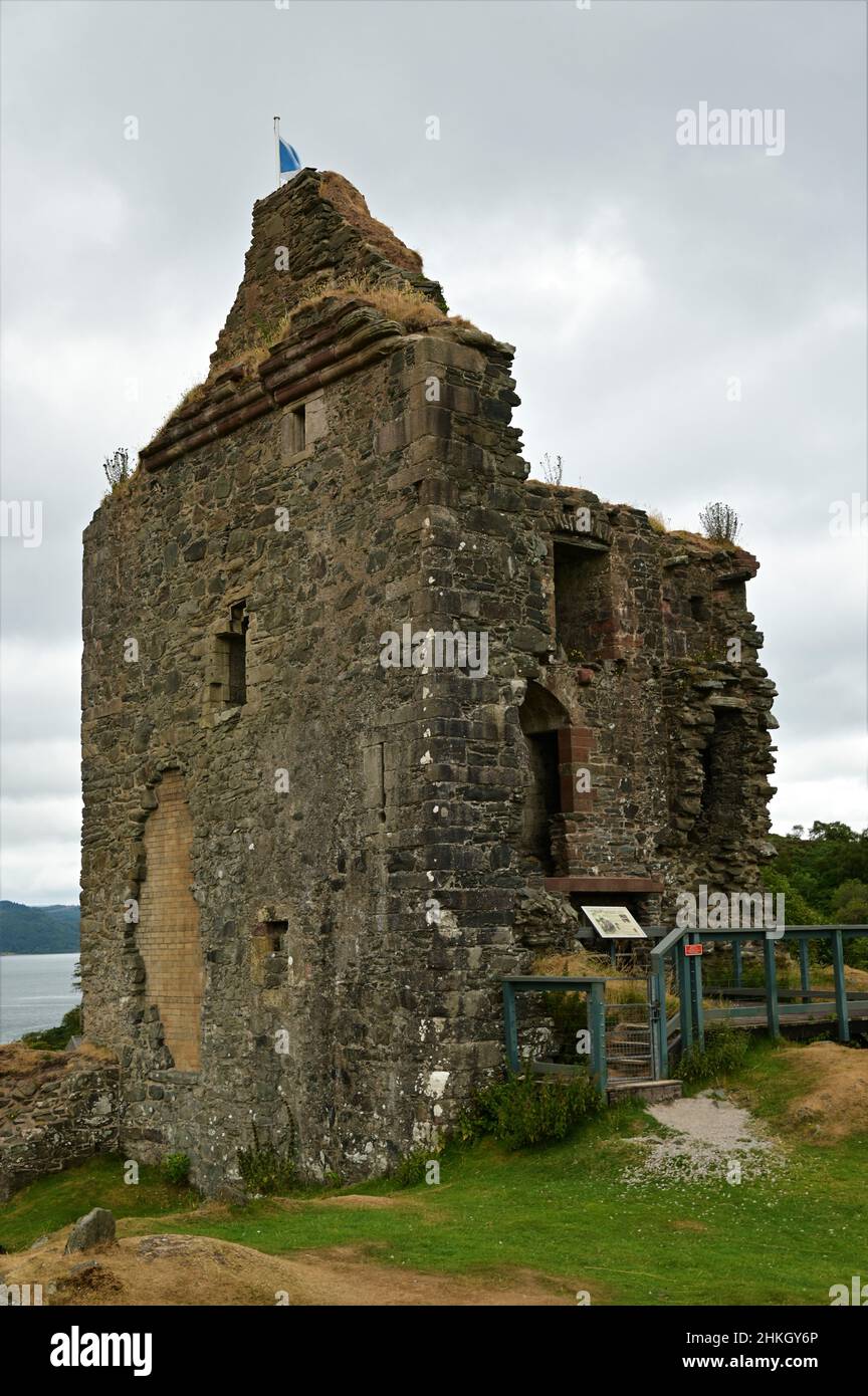 A view of the ruins of a medieval castle on a rocky promontory in the ...