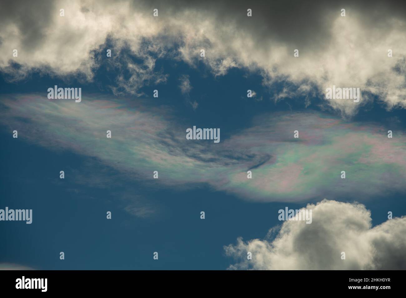 various colors in cloud in blue sky between white clouds blues pinks ...