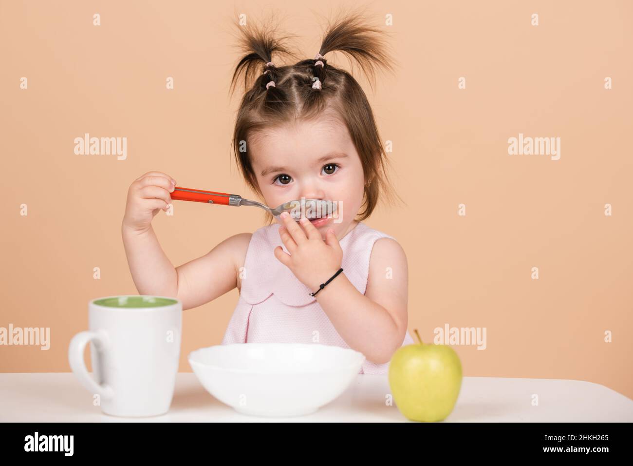 Cute baby child eat food, babies eating. Kid girl eating healthy food ...