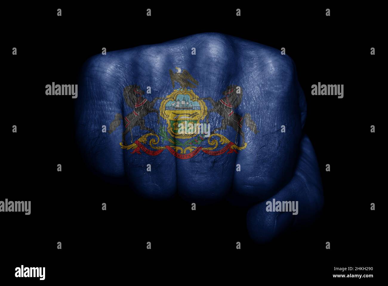 Pennsylvania US country Flag painted on strong fist on black background ...