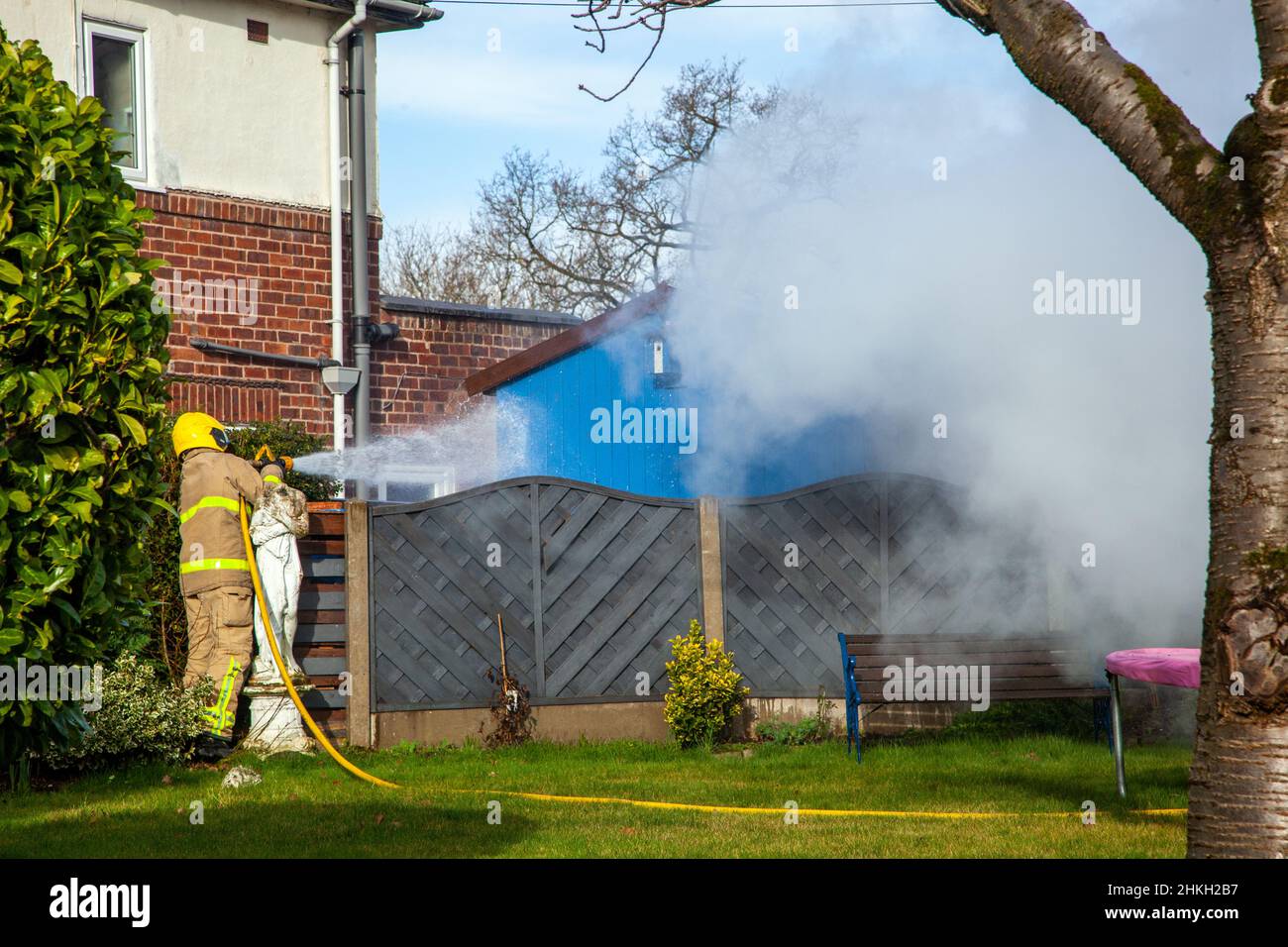 Firemen from the Cheshire fire and recue service attending a garden ...