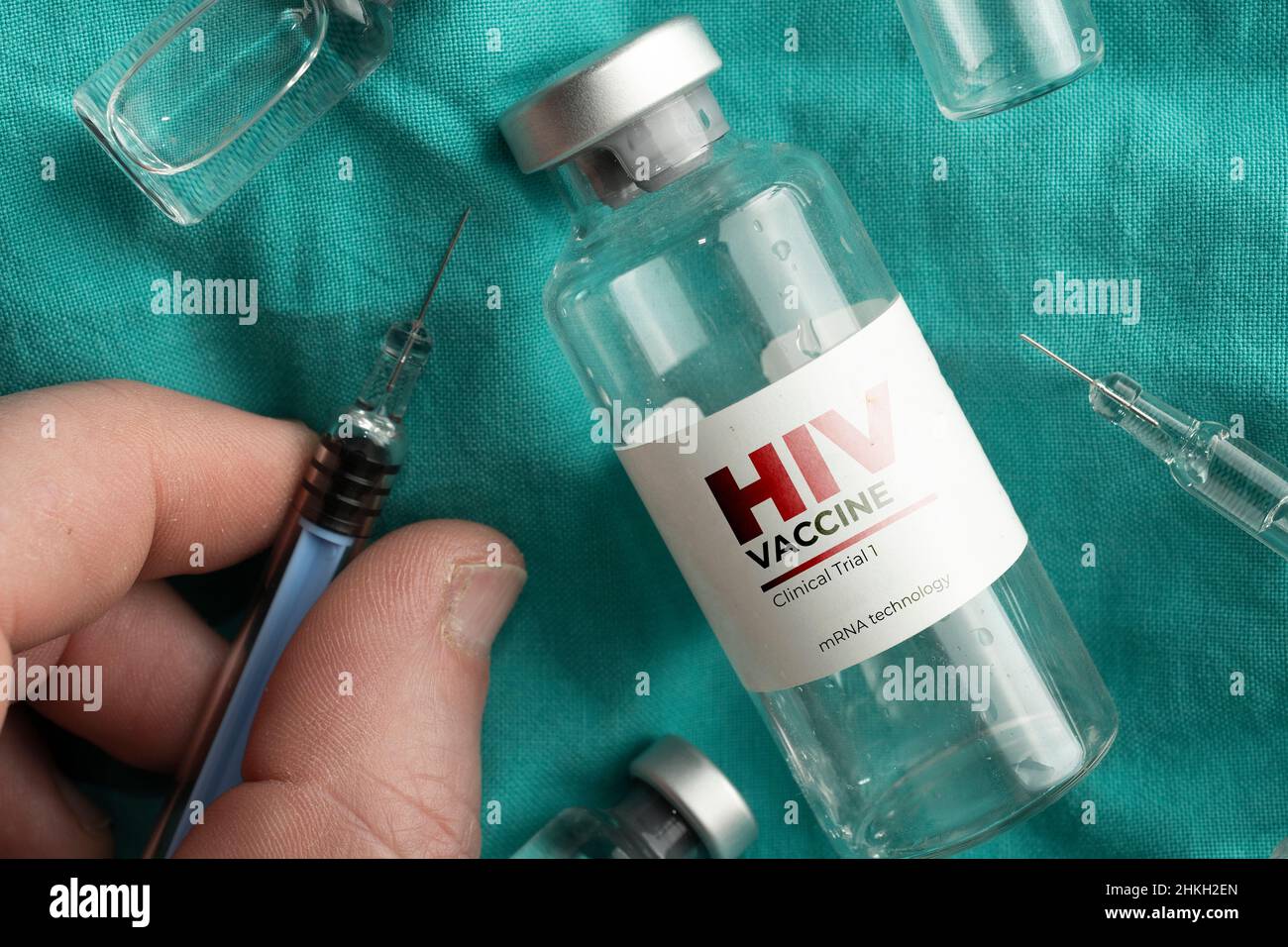 Hiv vaccine vials on a doctor' coat and an hand holding a syringe Stock ...