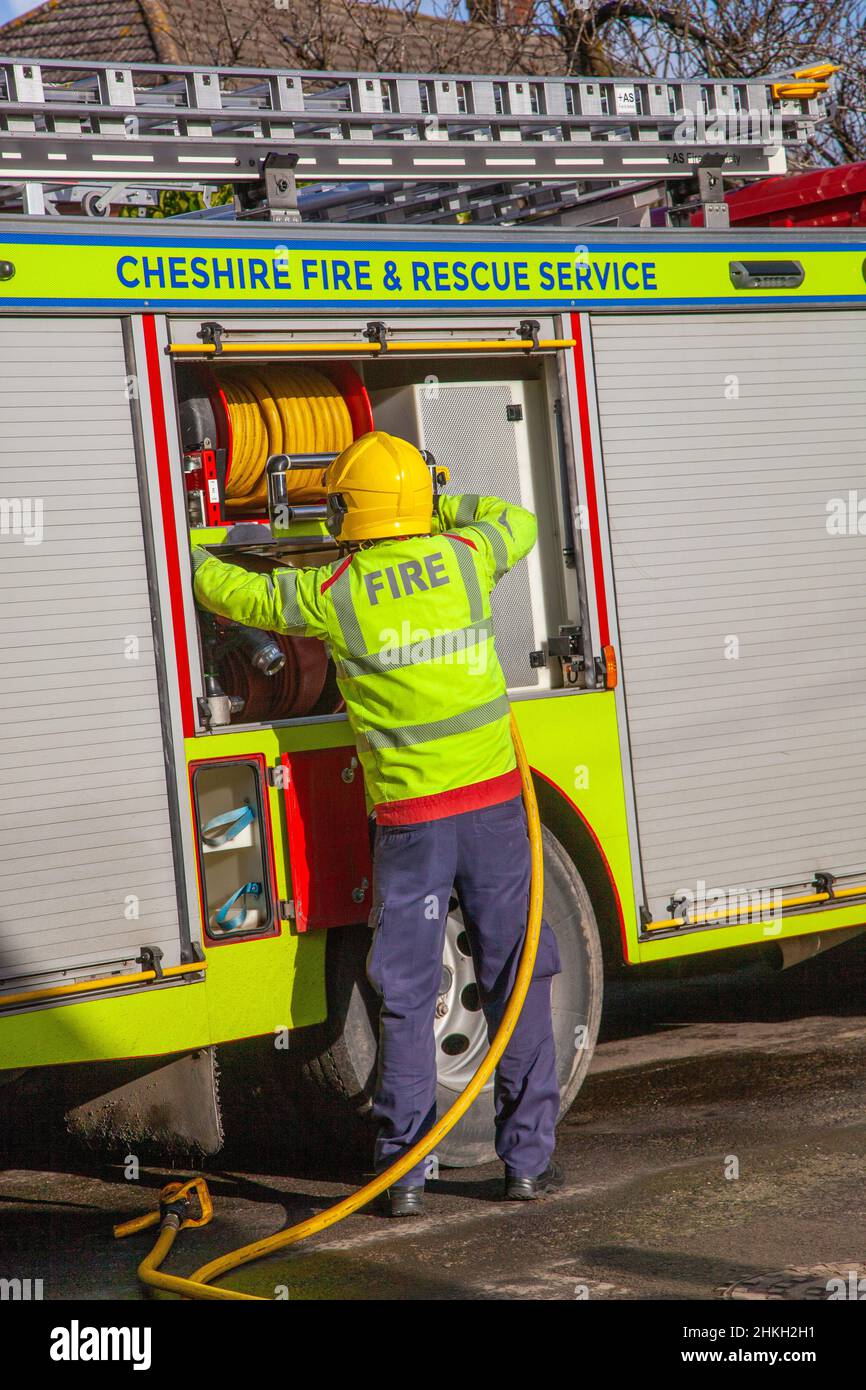Firemen from the Cheshire fire and recue service attending a garden ...