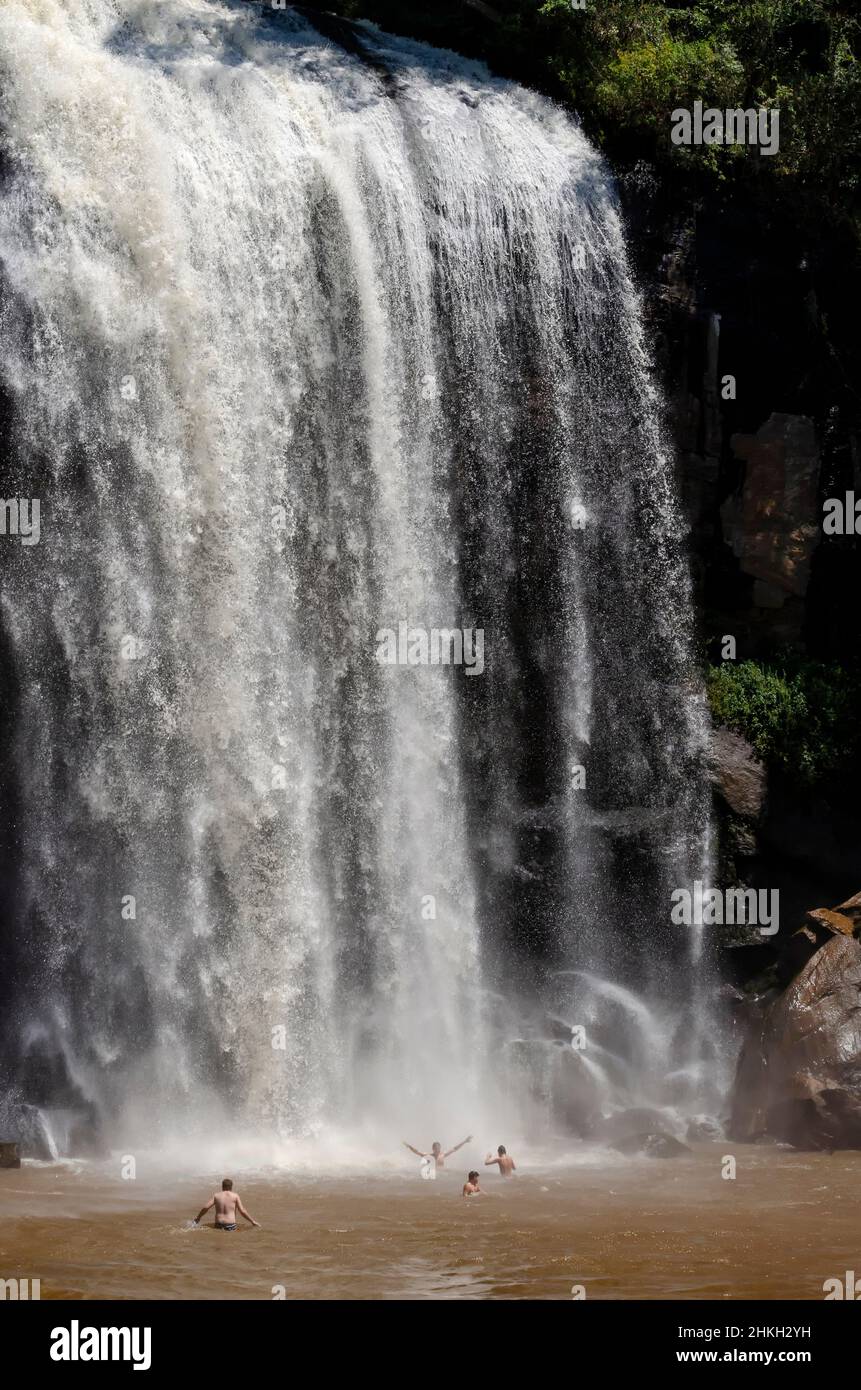 People refreshing themselves under the waterfall Stock Photo - Alamy
