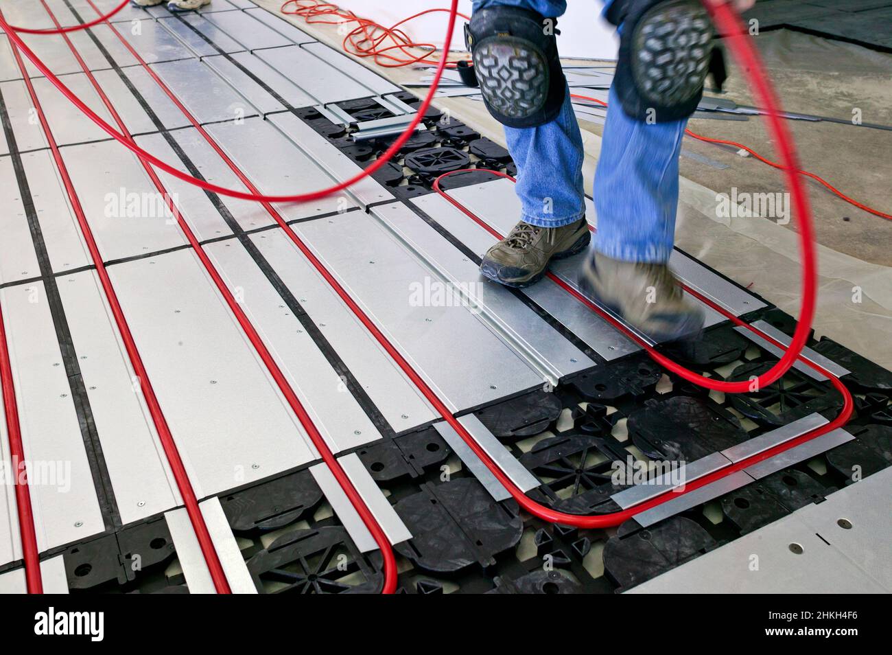 Laying PEX tubing in Hydronics floor installation Stock Photo - Alamy