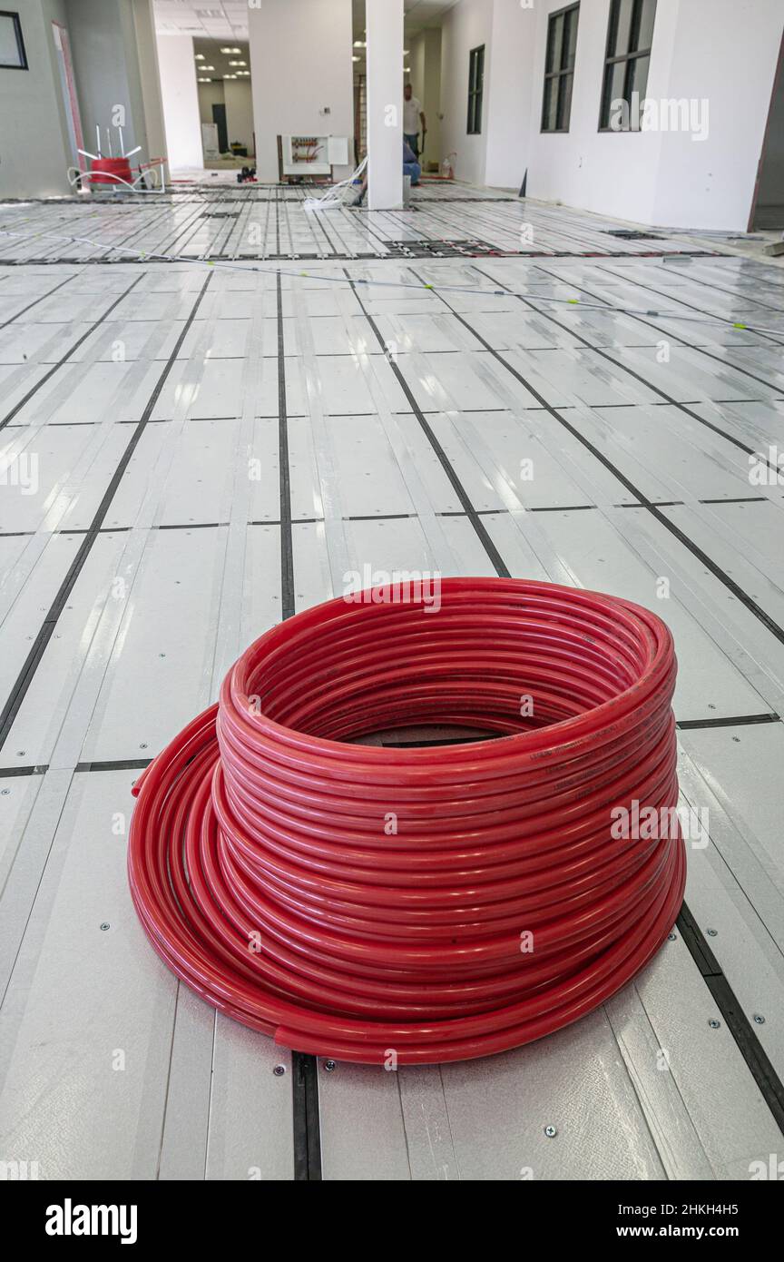 PEX coil in commercial Hydronics flooring installation Stock Photo - Alamy