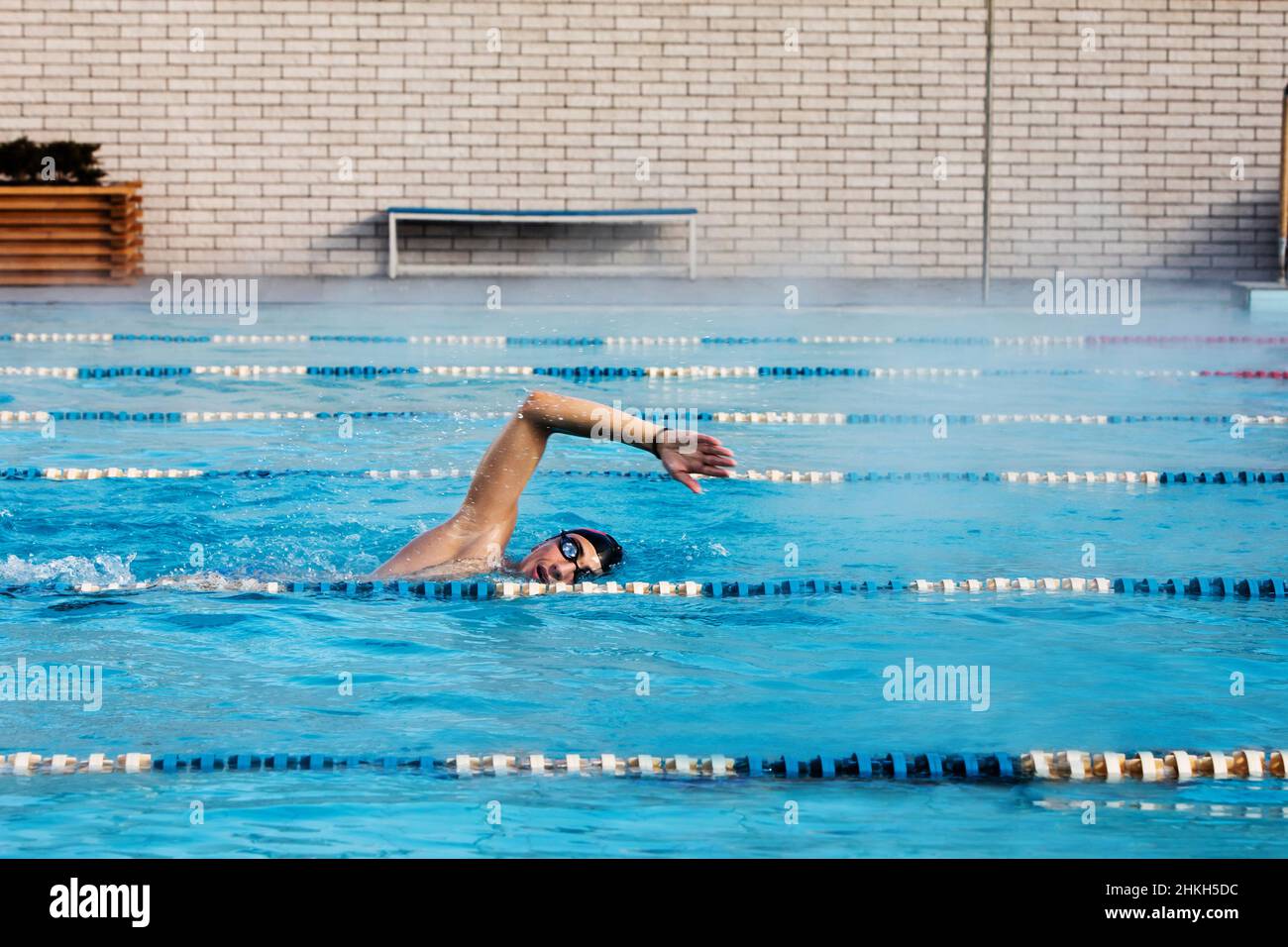 Professional male swimmer swimming in the pool Stock Photo - Alamy