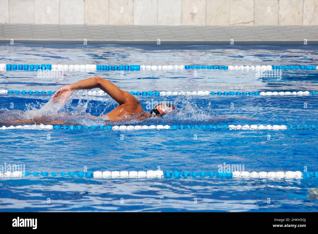Professional male swimmer swimming in the pool Stock Photo - Alamy