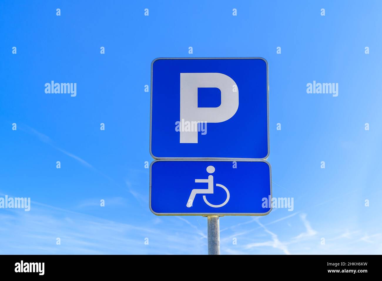 Big blue P sign for parking and parking sign for persons with ...