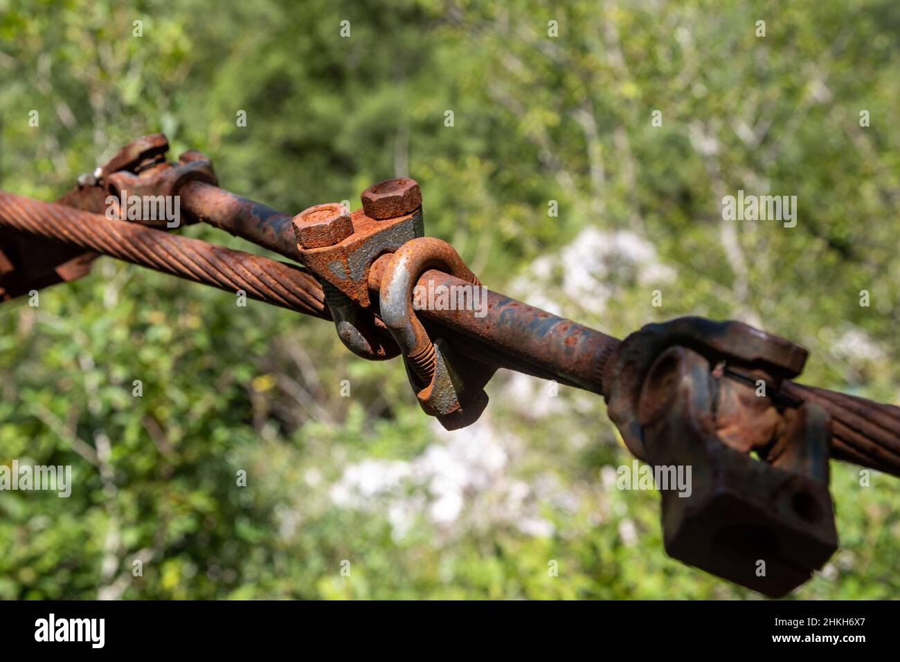 Rusty steel cable connections, and rope clamps in sunlight Stock Photo ...