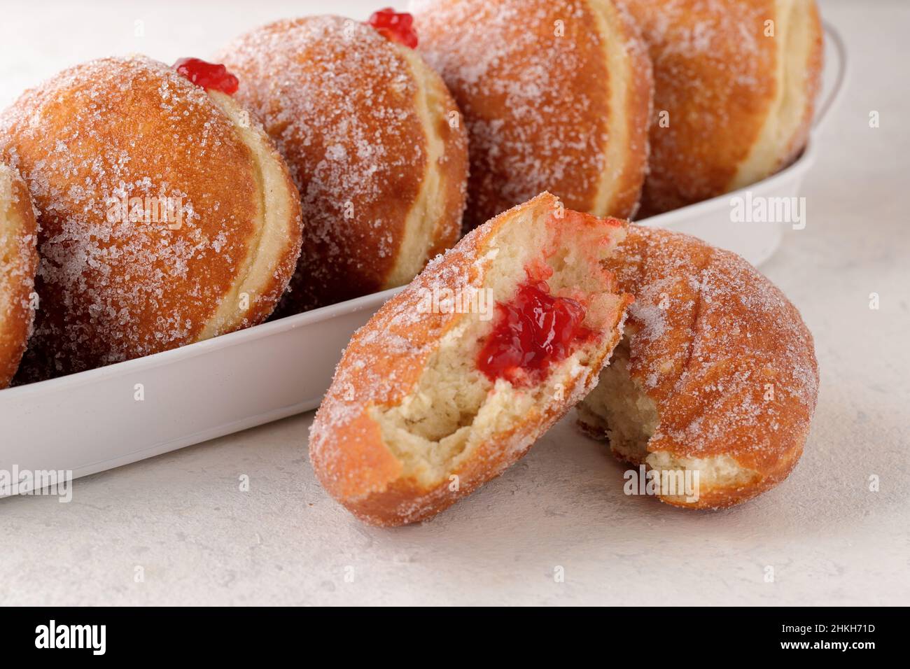 Traditional English raspberry jam filled deep fried sugar coated ...