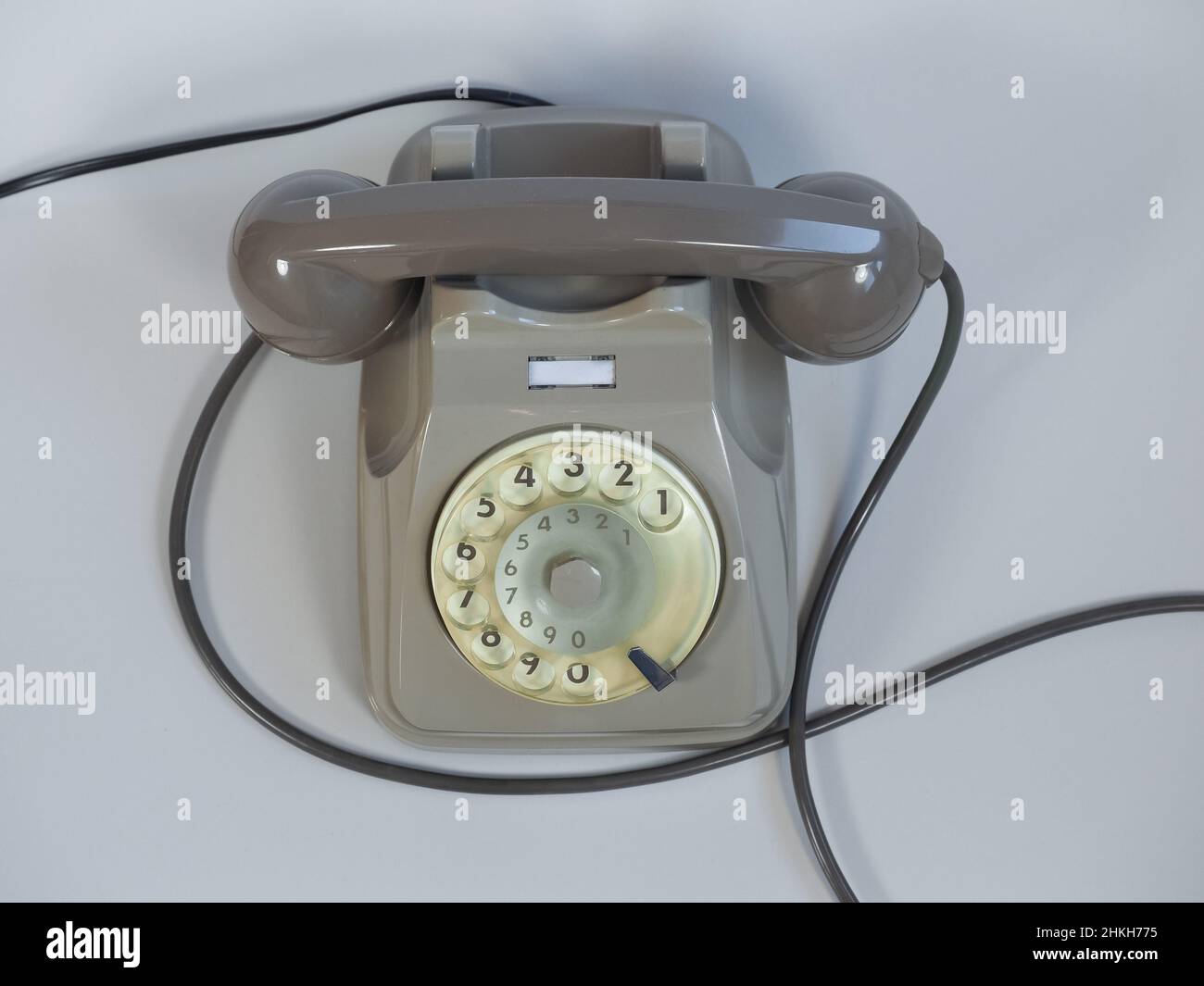 Vintage grey rotary dial analog landline telephone Stock Photo - Alamy