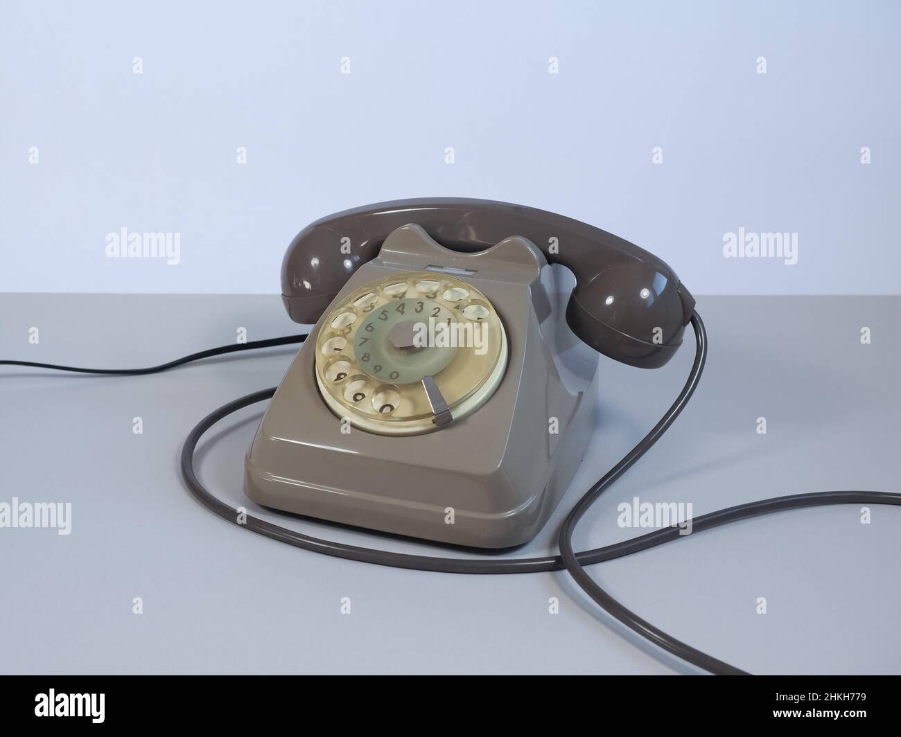 Vintage grey rotary dial analog landline telephone Stock Photo - Alamy