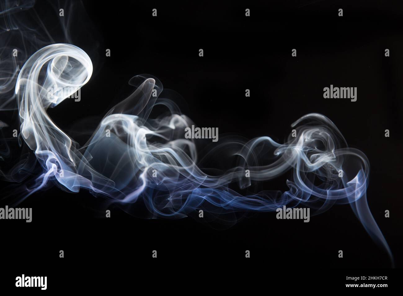 Illustration of white and blue fumes against the black background Stock ...