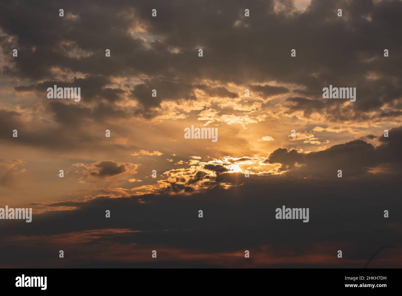 Dark Sunset Sky with Golden Light Stock Photo - Alamy