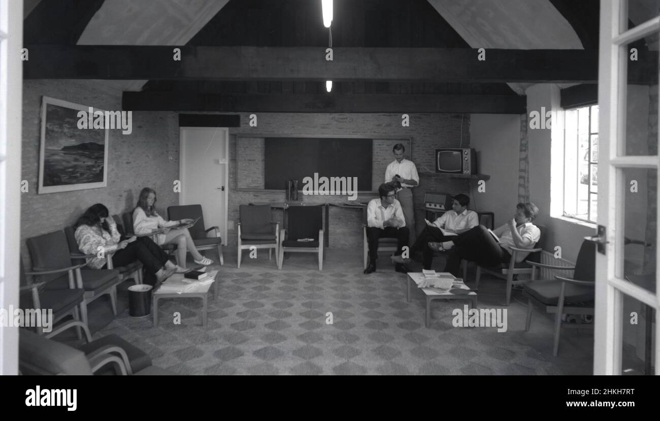 1960s, historical, college, post-graduate students in a common room ...
