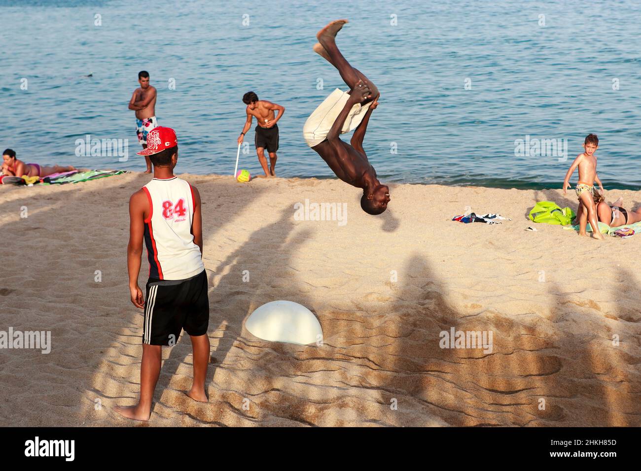 Barcelona, Spain -20 July 2020, A young man is engaged in acrobatics on ...