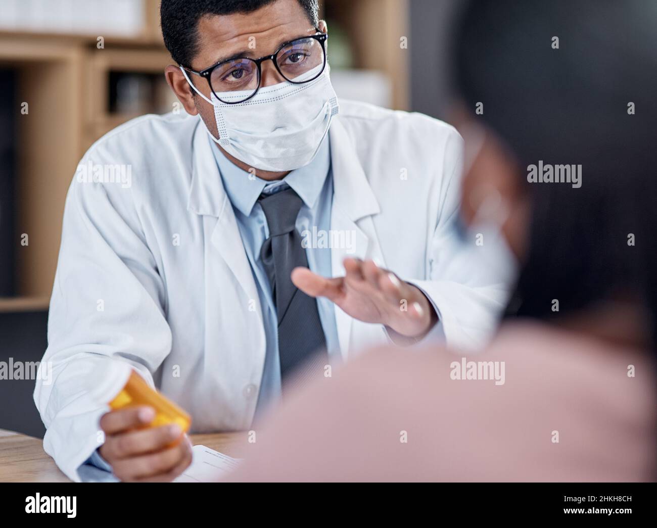 Ensuring the patient administers the correct dosage Stock Photo - Alamy