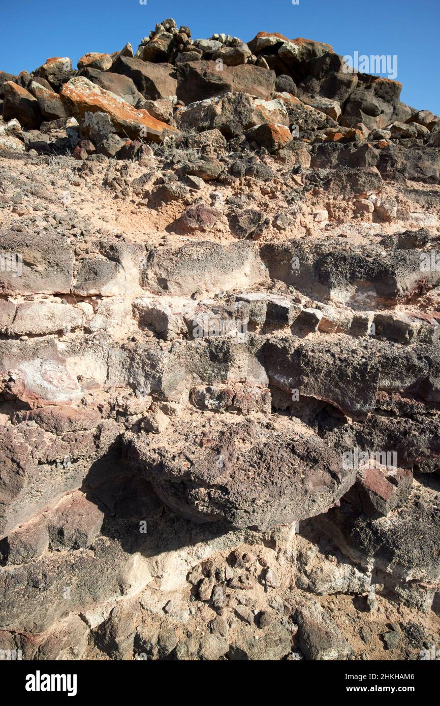 layers of volcanic rock strata inside the caldera of red montana roja ...