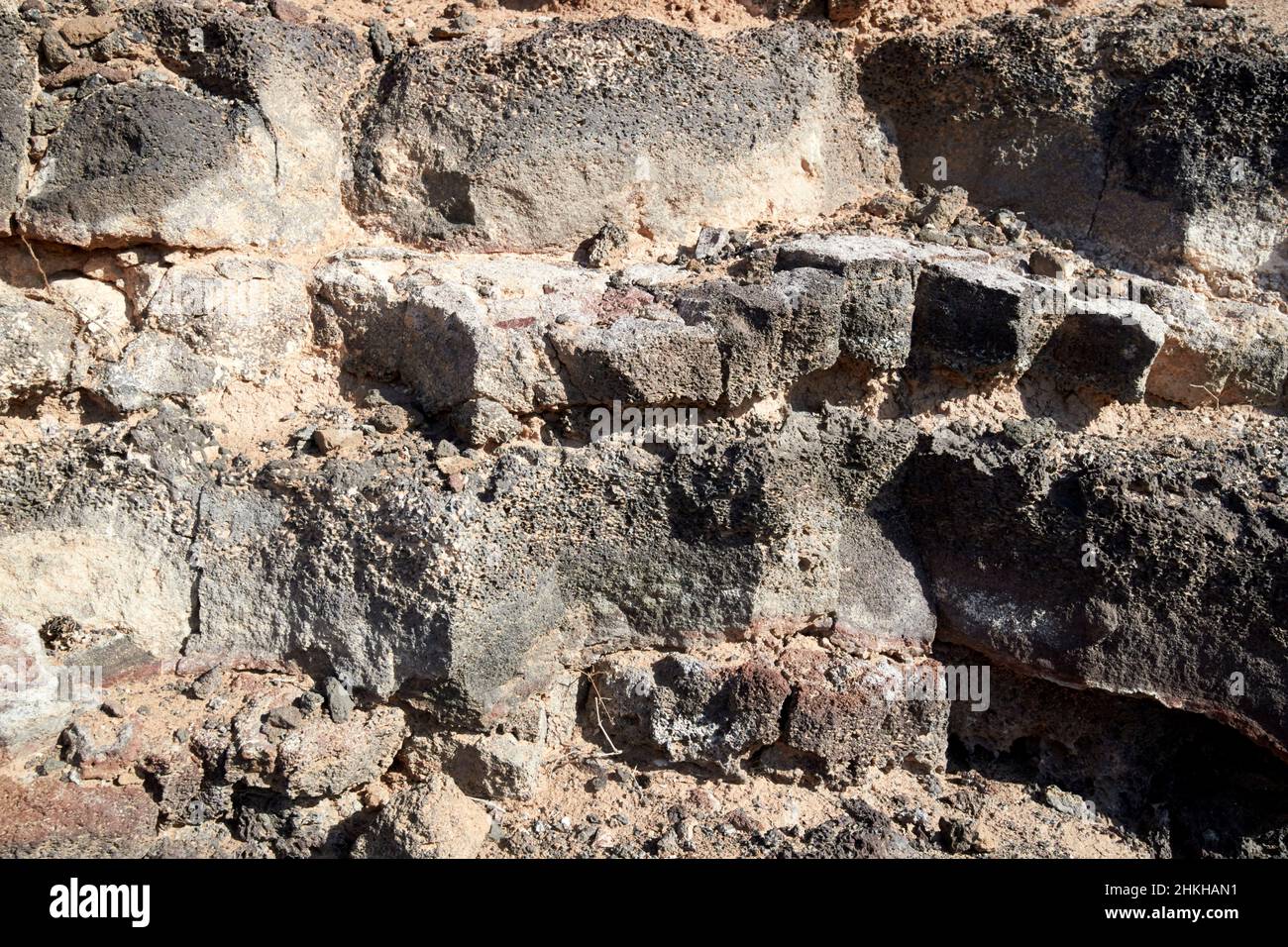 layers of volcanic rock strata inside the caldera of red montana roja ...