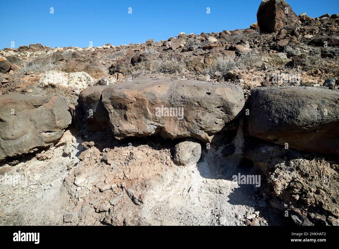 large boulders part of the cross section of the inside of the volcanic ...