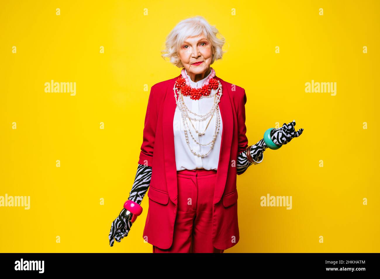 Happy and funny cool old lady with fashionable clothes portrait on ...