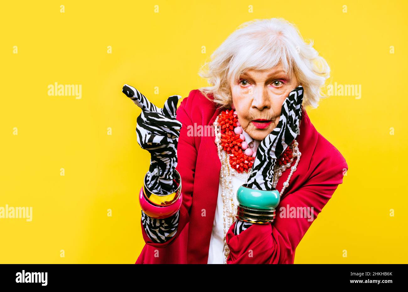 Happy and funny cool old lady with fashionable clothes portrait on ...