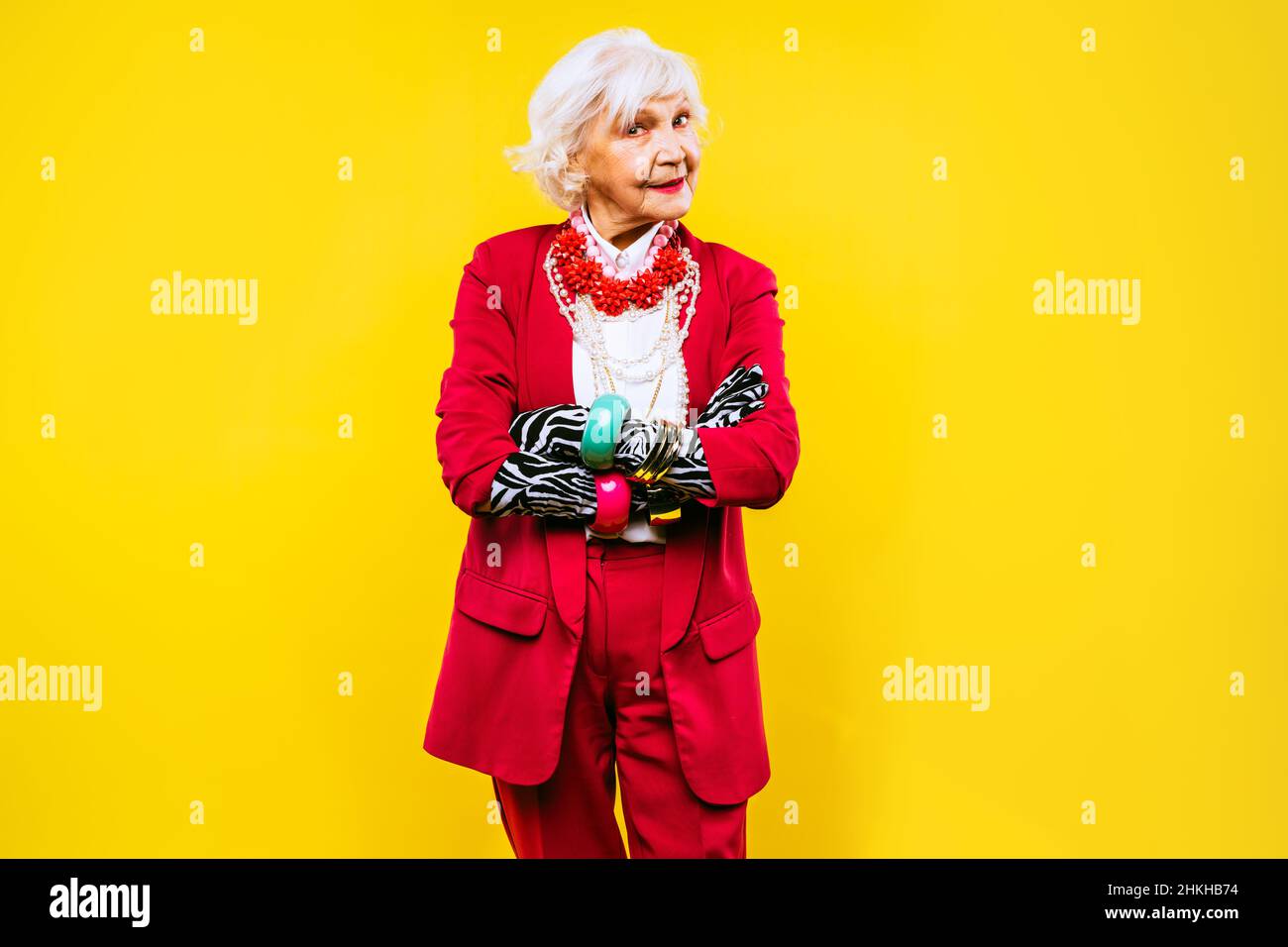 Happy and funny cool old lady with fashionable clothes portrait on ...