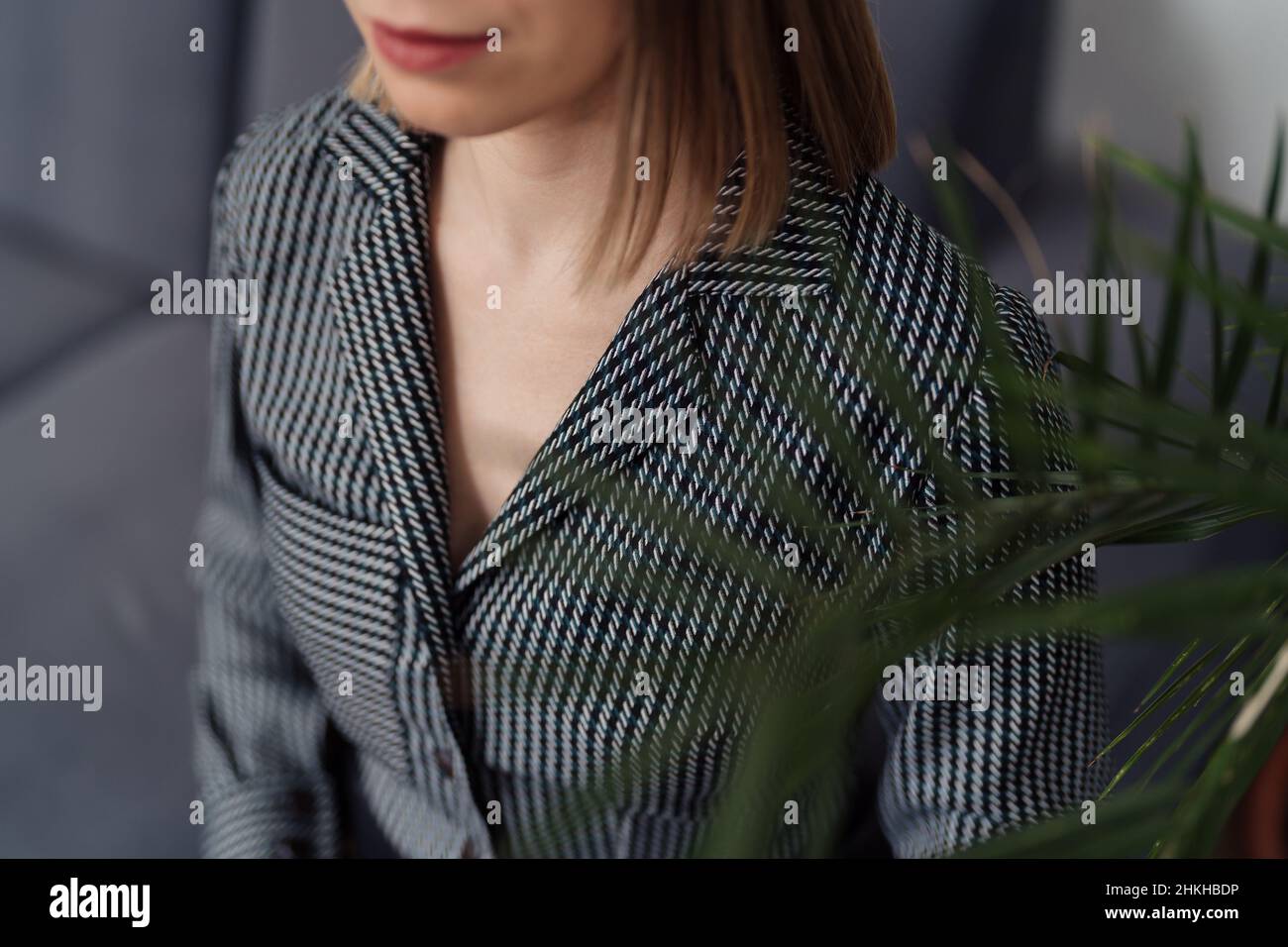 Cropped image of a woman with beautiful v neck line in a shirt with ...