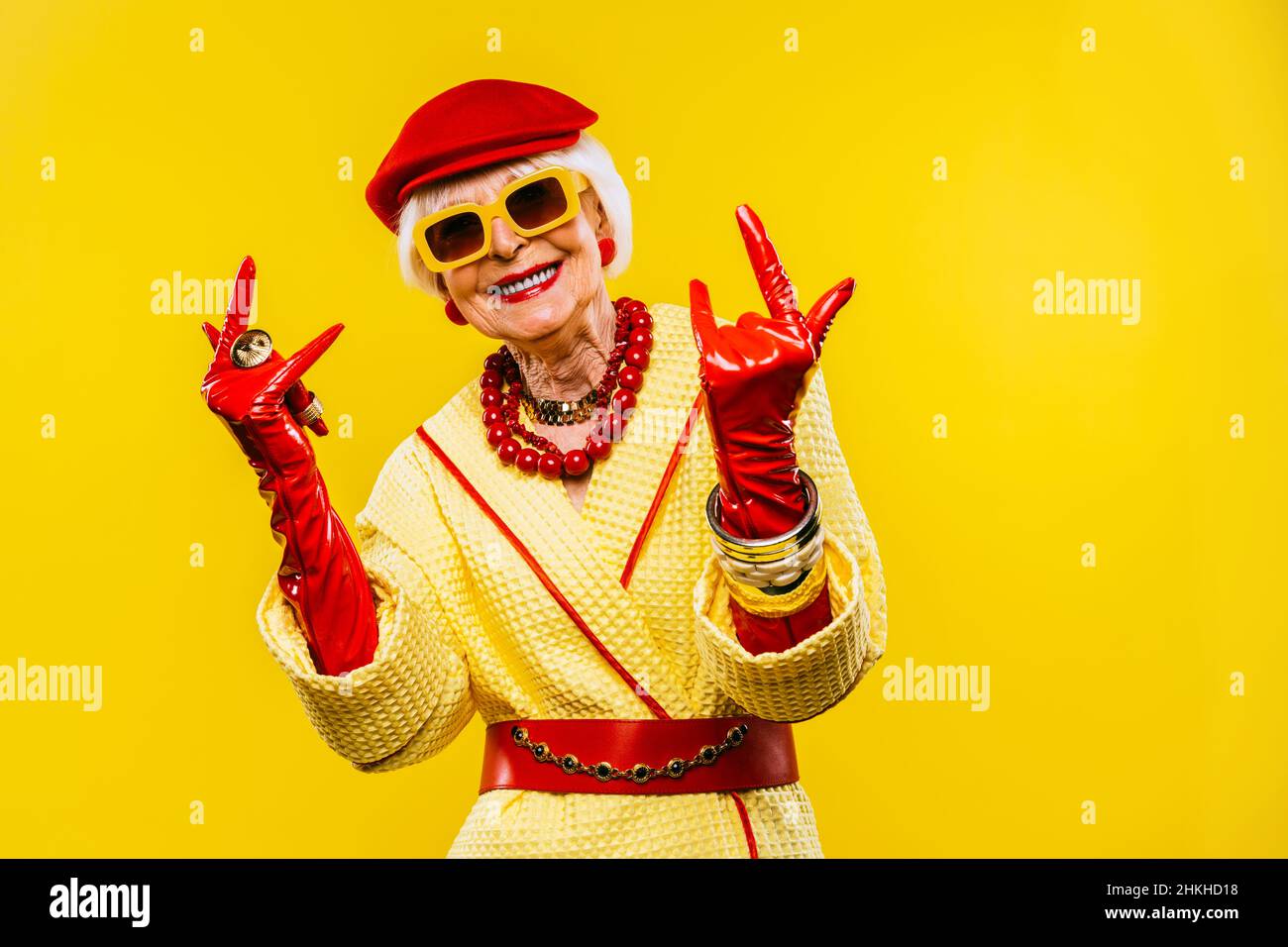 Happy and funny cool old lady with fashionable clothes portrait on ...