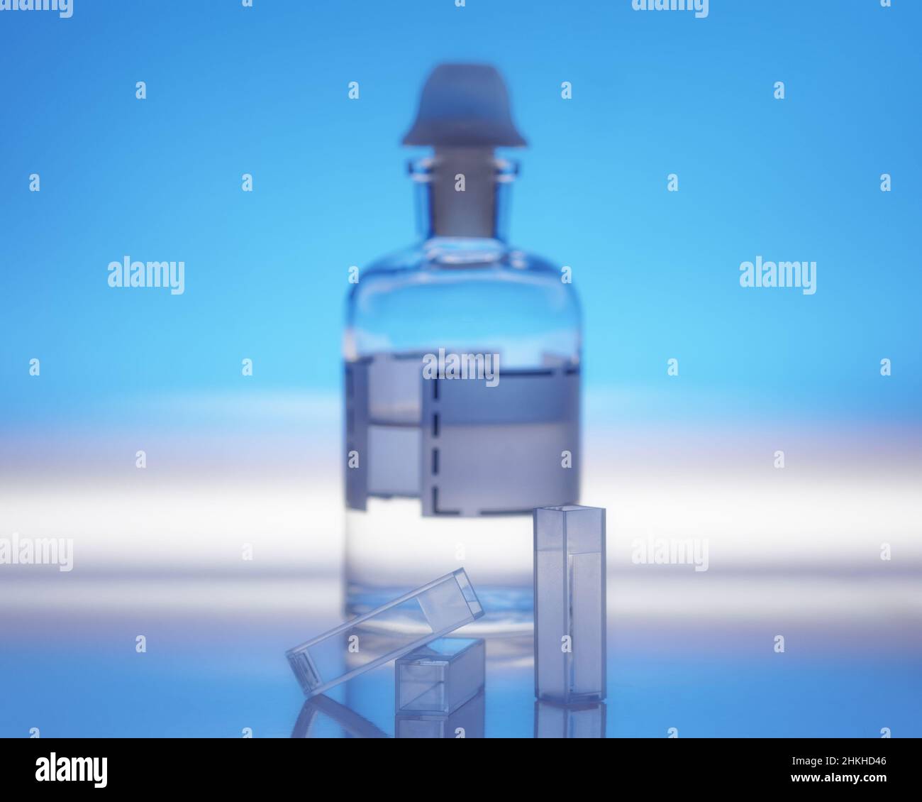 Cuvettes and reagent bottle Stock Photo - Alamy