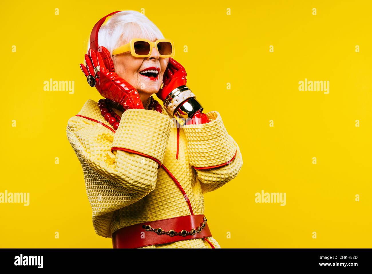 Happy and funny cool old lady with fashionable clothes portrait on ...