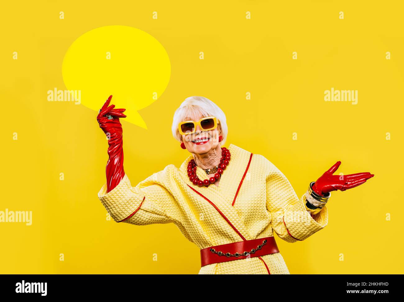 Happy and funny cool old lady with fashionable clothes portrait on ...
