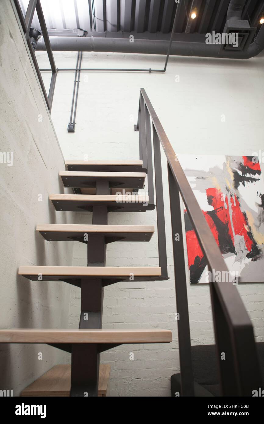 Vertical low angle shot of a modern staircase indoors in an apartment ...