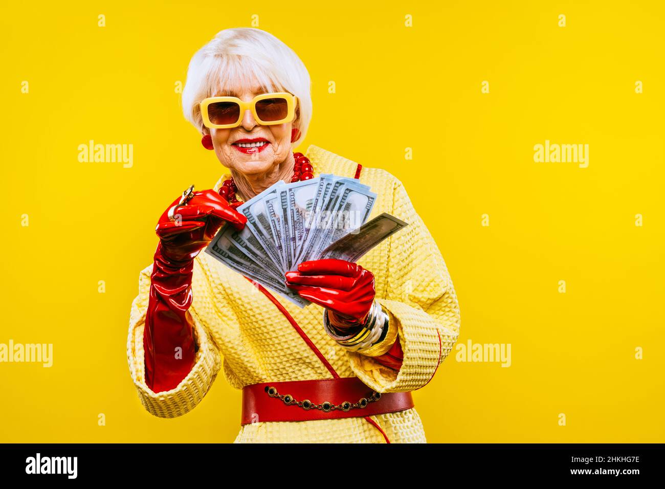 Happy and funny cool old lady with fashionable clothes portrait on ...