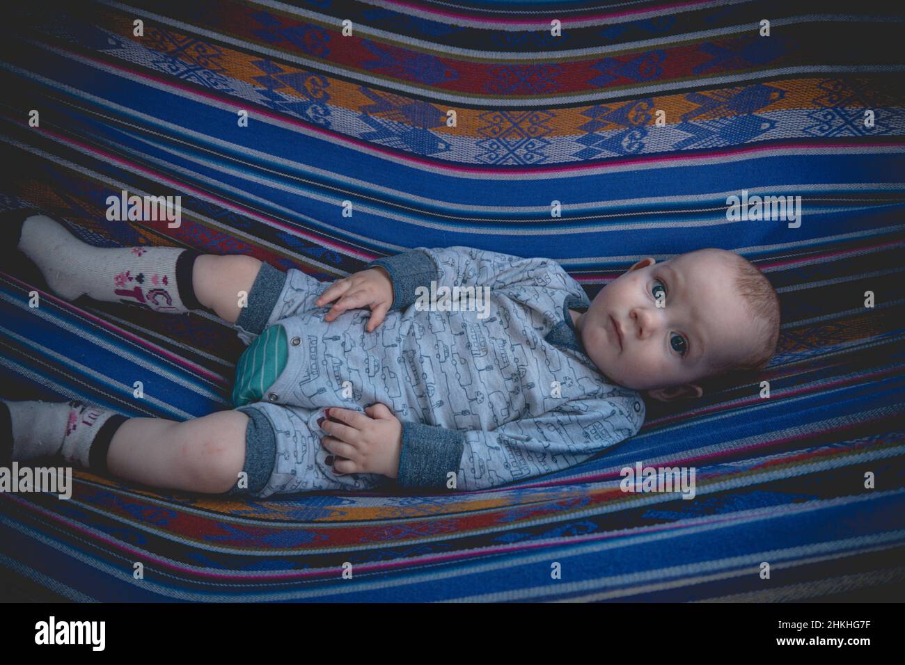 Surprised cute baby and looking at the viewer Stock Photo - Alamy