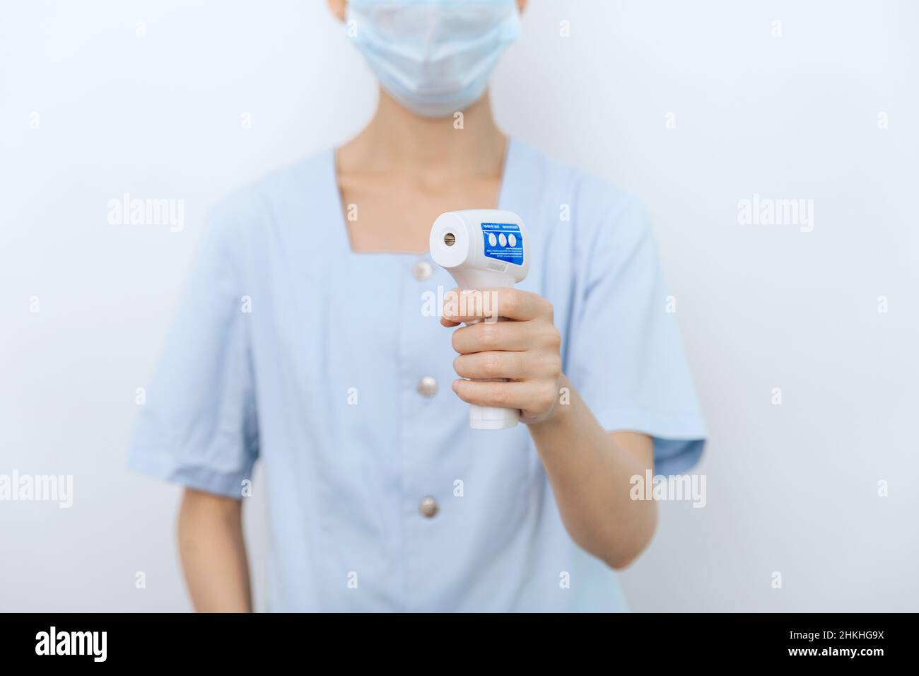 Temperature measurement gun in doctor hands. Close-up shot of doctor ...