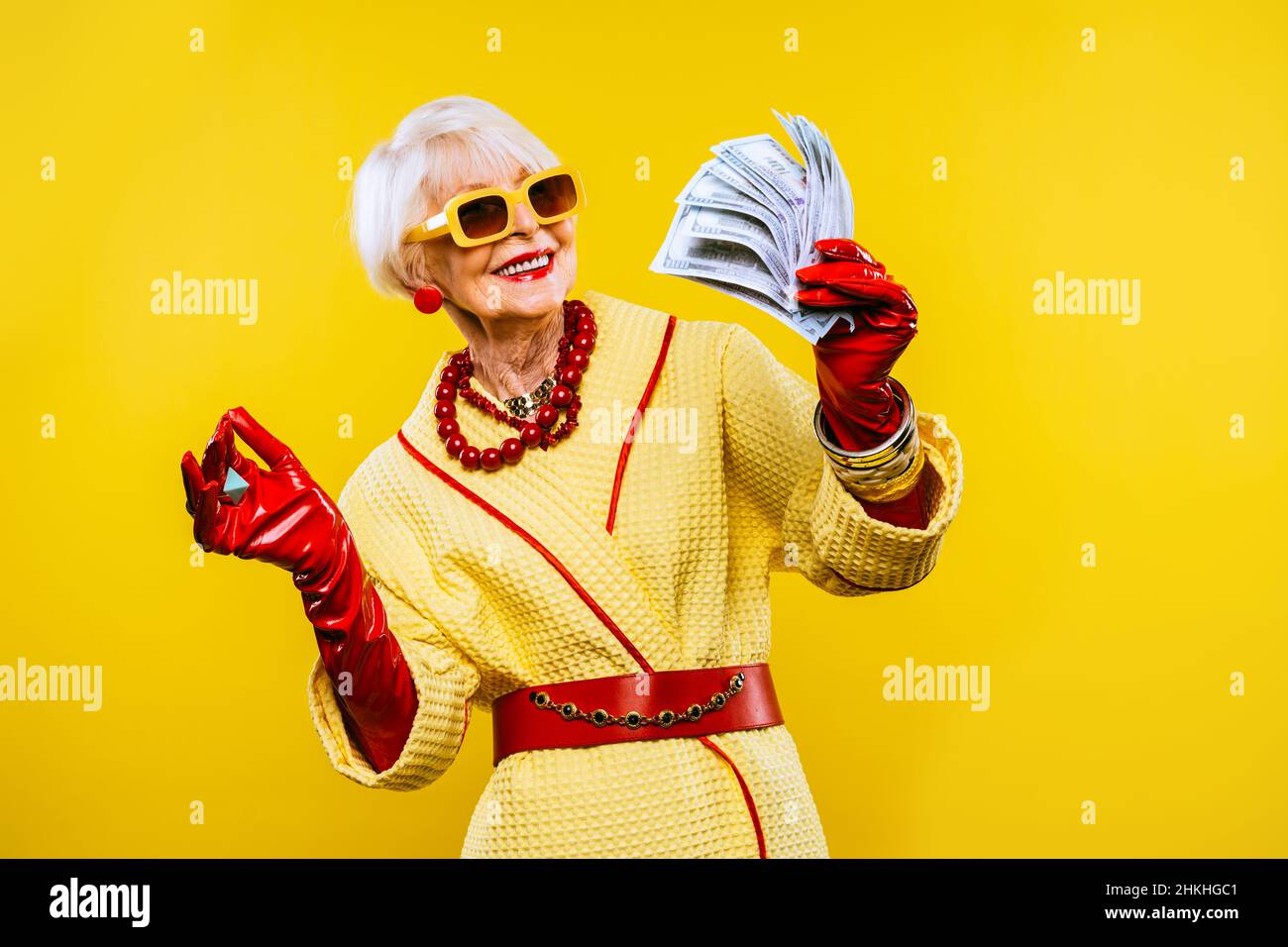 Happy and funny cool old lady with fashionable clothes portrait on ...