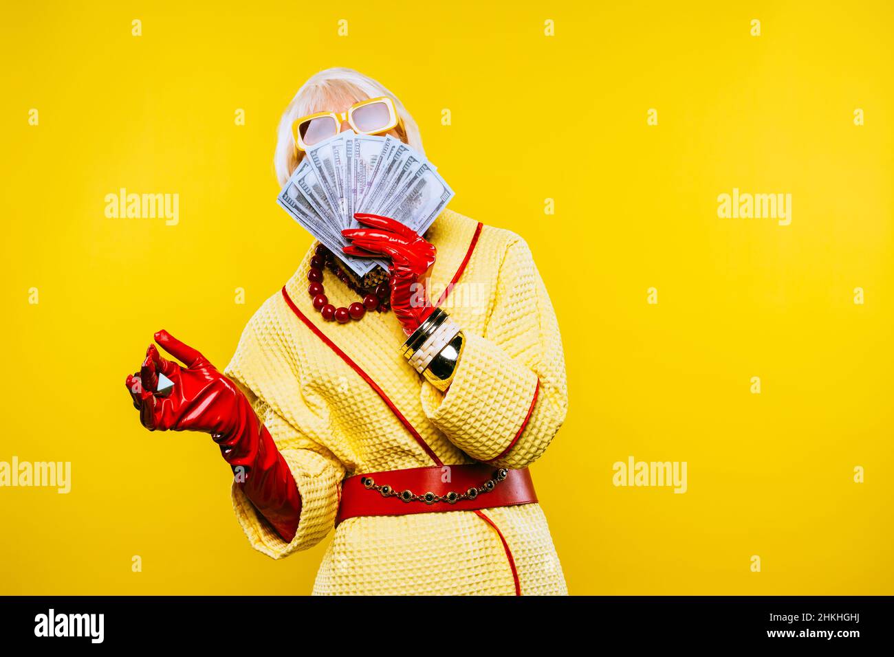 Happy and funny cool old lady with fashionable clothes portrait on ...