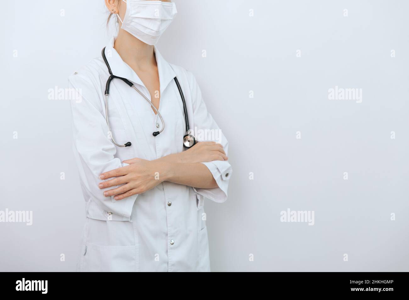 Doctor with stethoscope in medical coat on white background. Front ...
