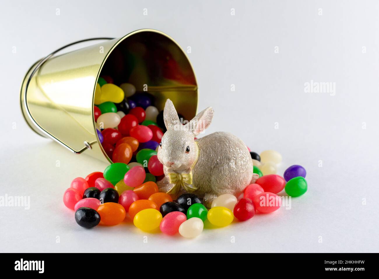 An Easter bunny figurine surrounded by assorted jelly beans from ...